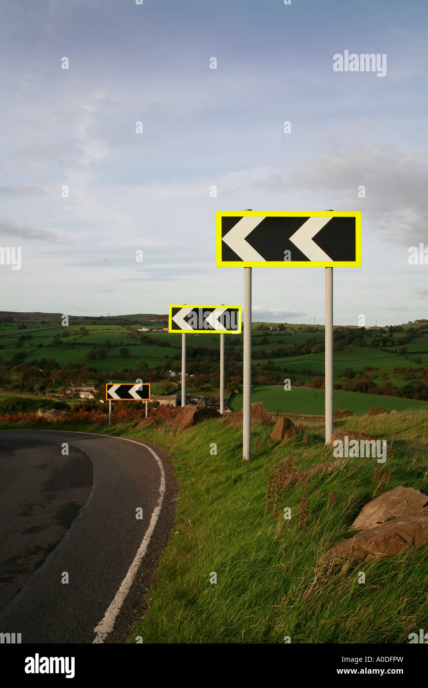 Road Direction Chevron signs on a left hand corner Stock Photo - Alamy