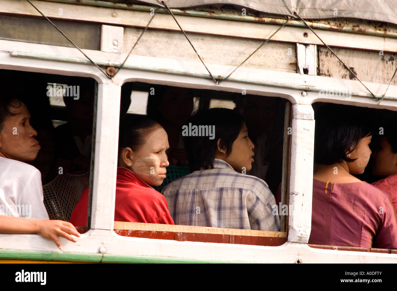 Stock photograph of passengers riding in a local bus at Bago in Myanmar ...