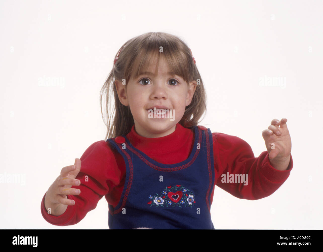 Expressive little girl posing Stock Photo - Alamy