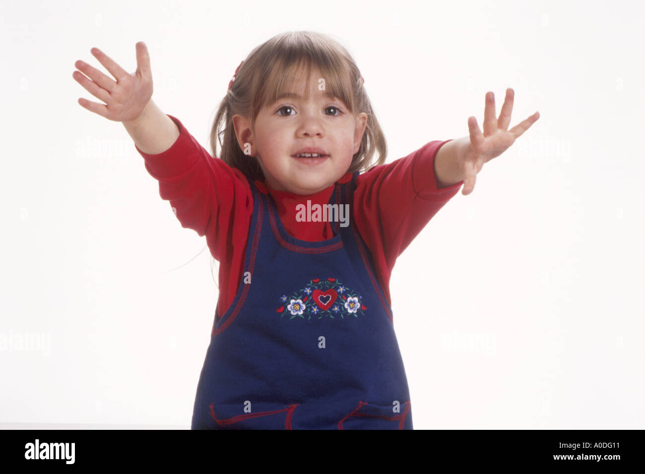 Expressive little girl posing Stock Photo - Alamy