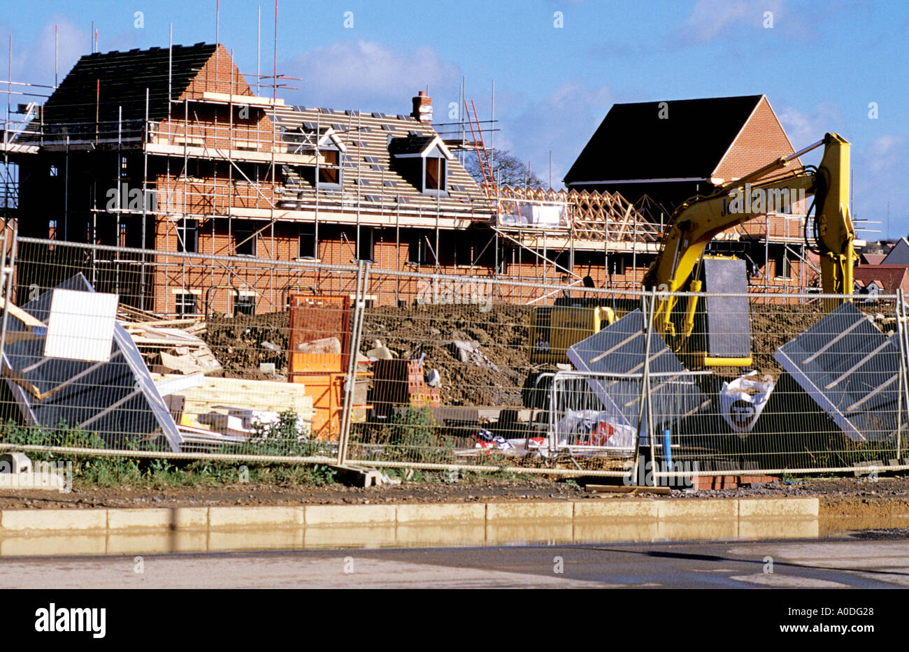 Half constructed house with scaffolding New housing estate Swindon ...