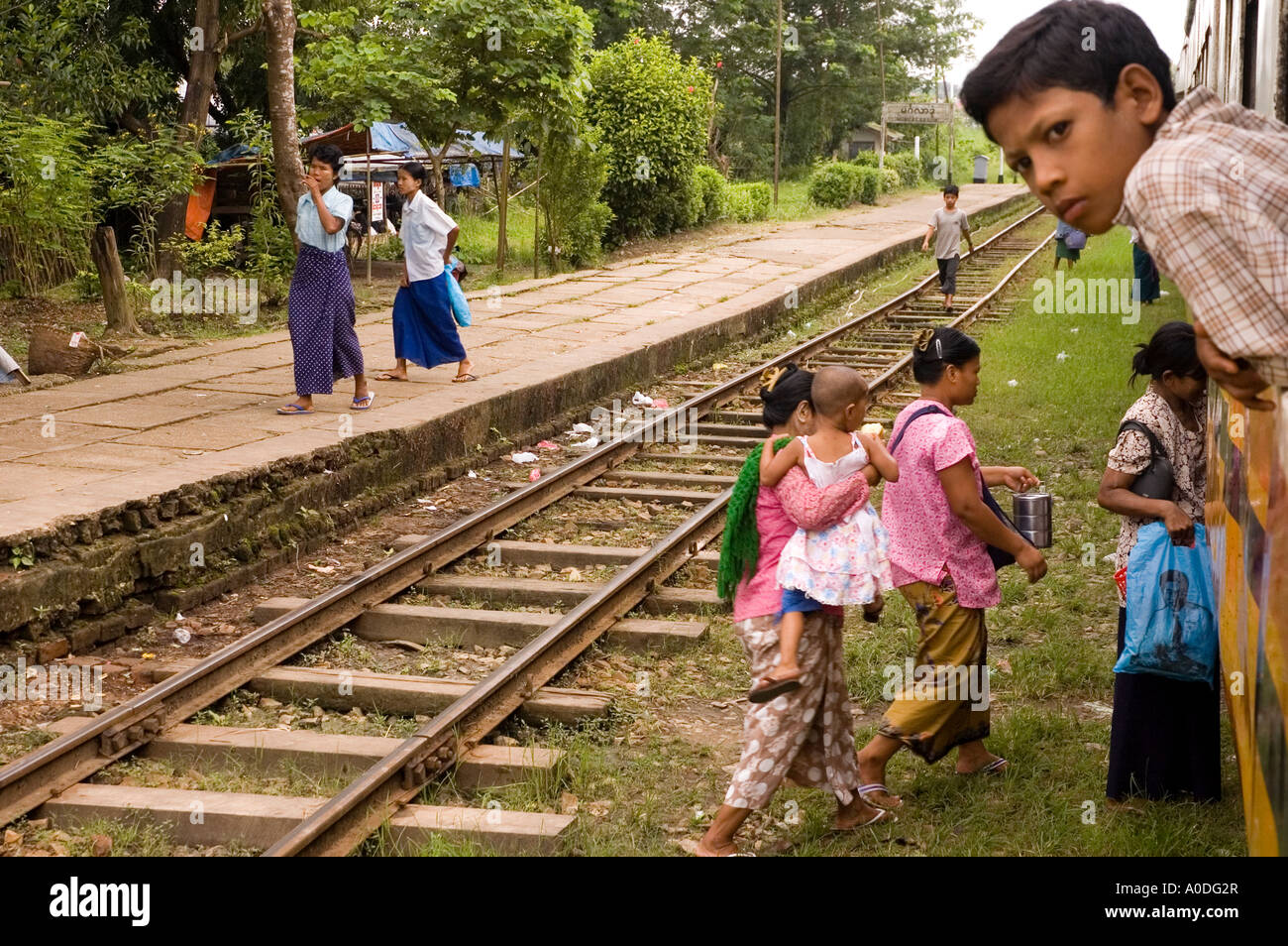 Stock photograph of passengers catching a suburban train in Yangon in ...