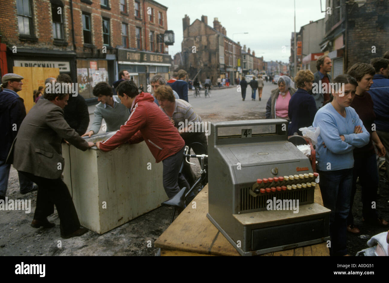 Toxteth Riots 1981. Clearing up after a night of rioting, men removing ...