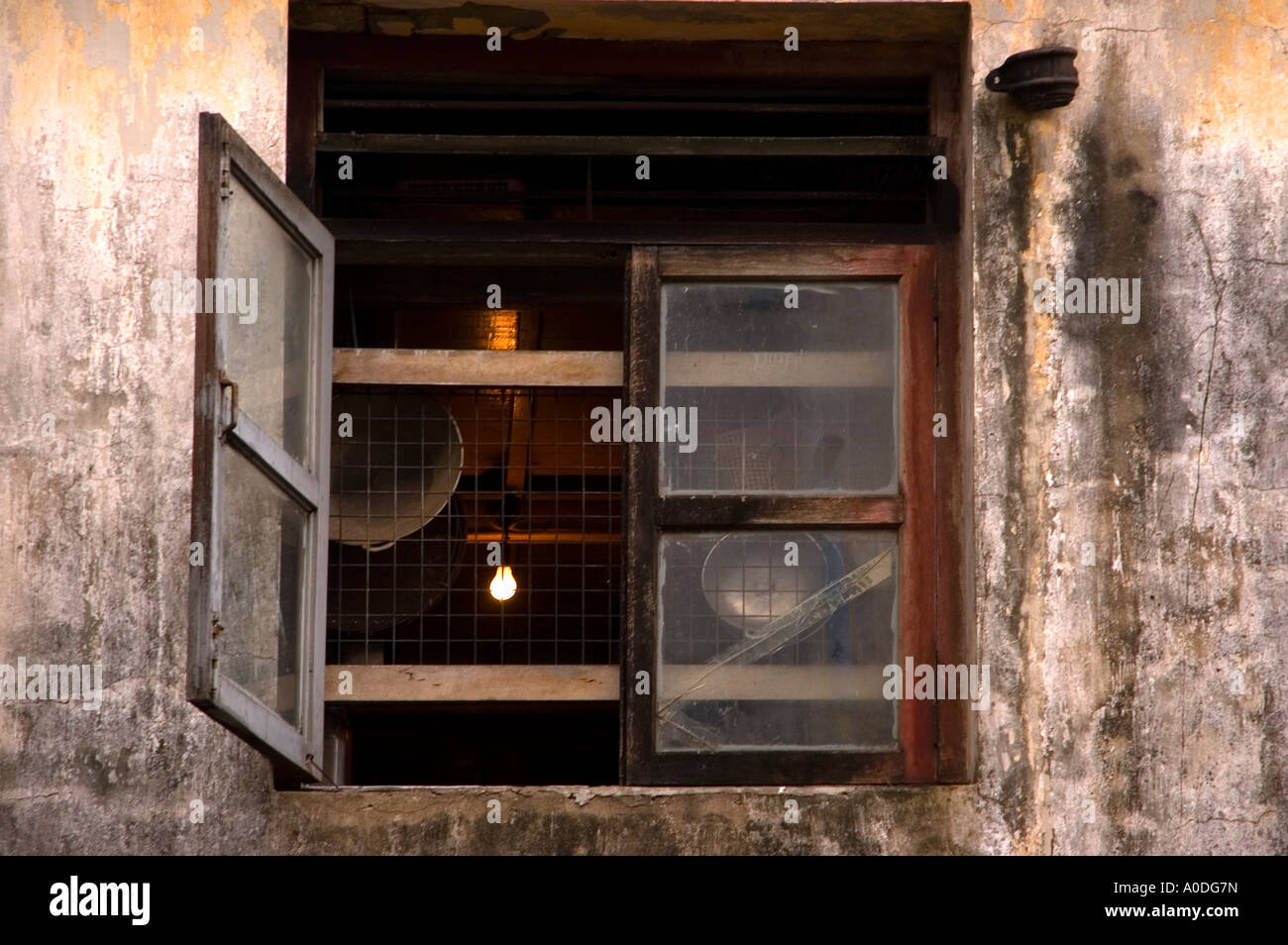 Stock photograph of a window with a light bulb in Yangon in Myanmar ...