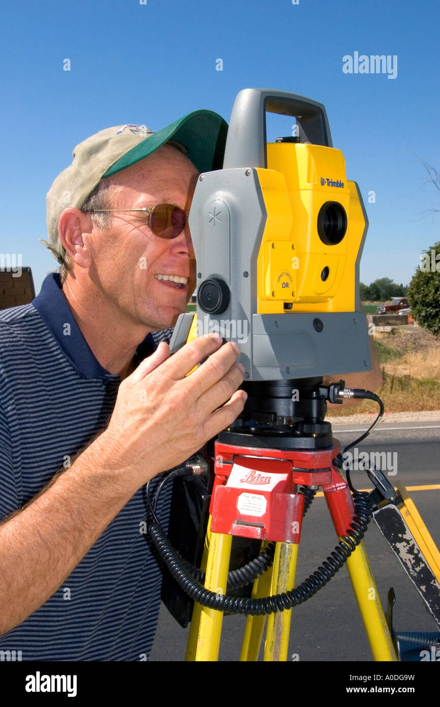 Surveyor using a laser transit in Boise Idaho Stock Photo - Alamy