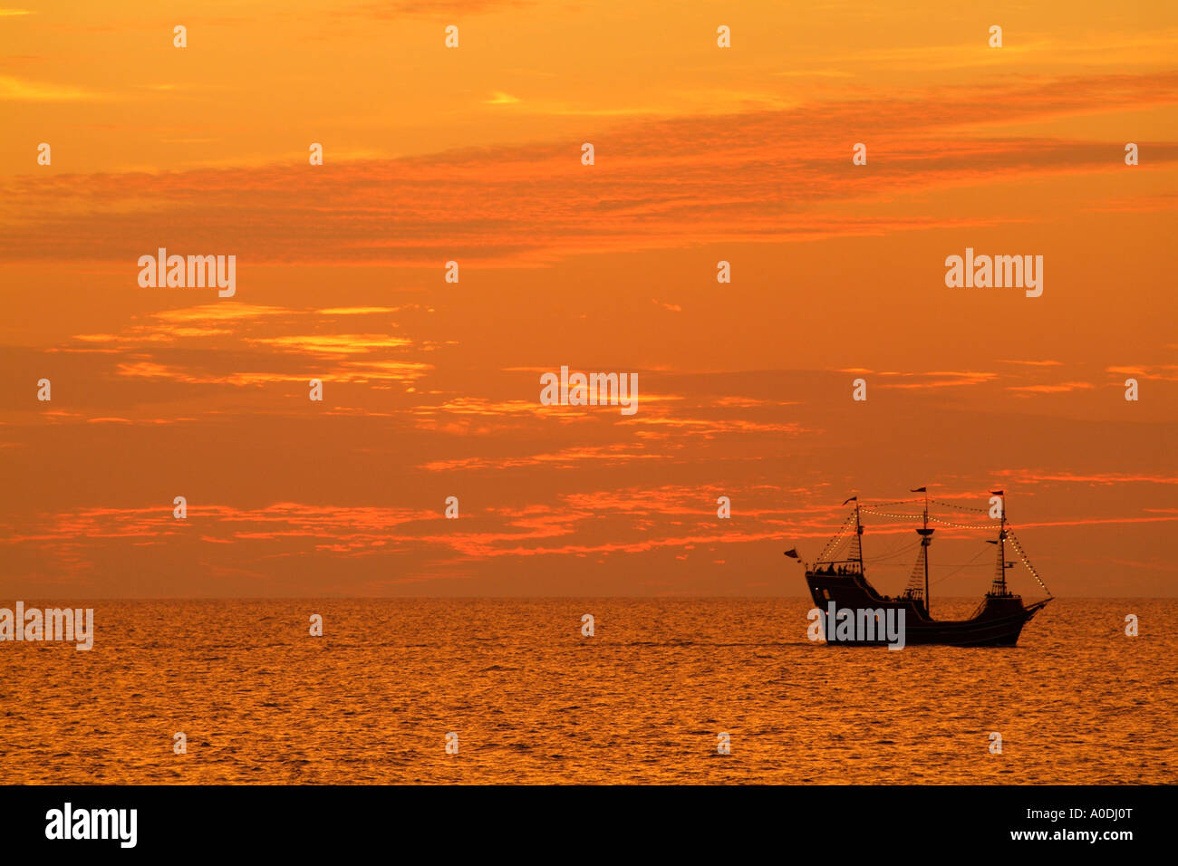 Sunset Florida USA. A tourist pirate boat on Gulf of Mexico sailing ...