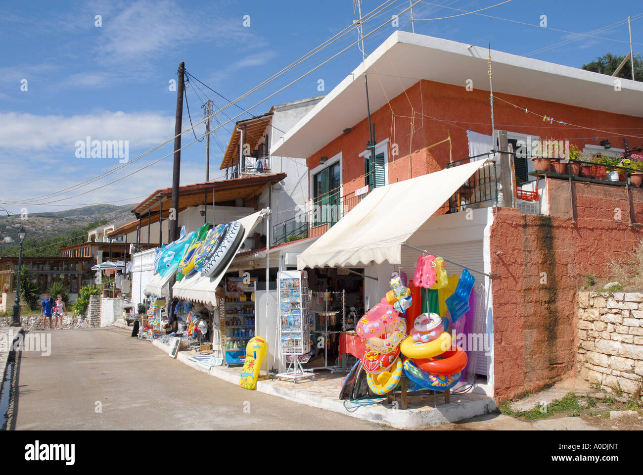 Small shop selling brightly coloured tourist souvenirs, Kassiopi, Corfu ...