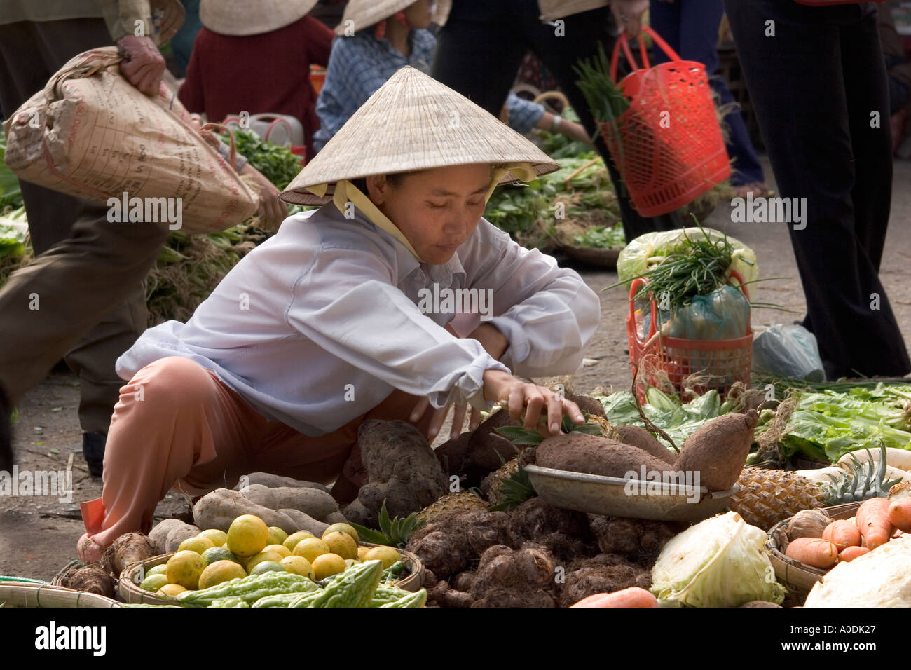 Vietnam Hoi An Old Town Central Market woman weighing yam on vegetable ...