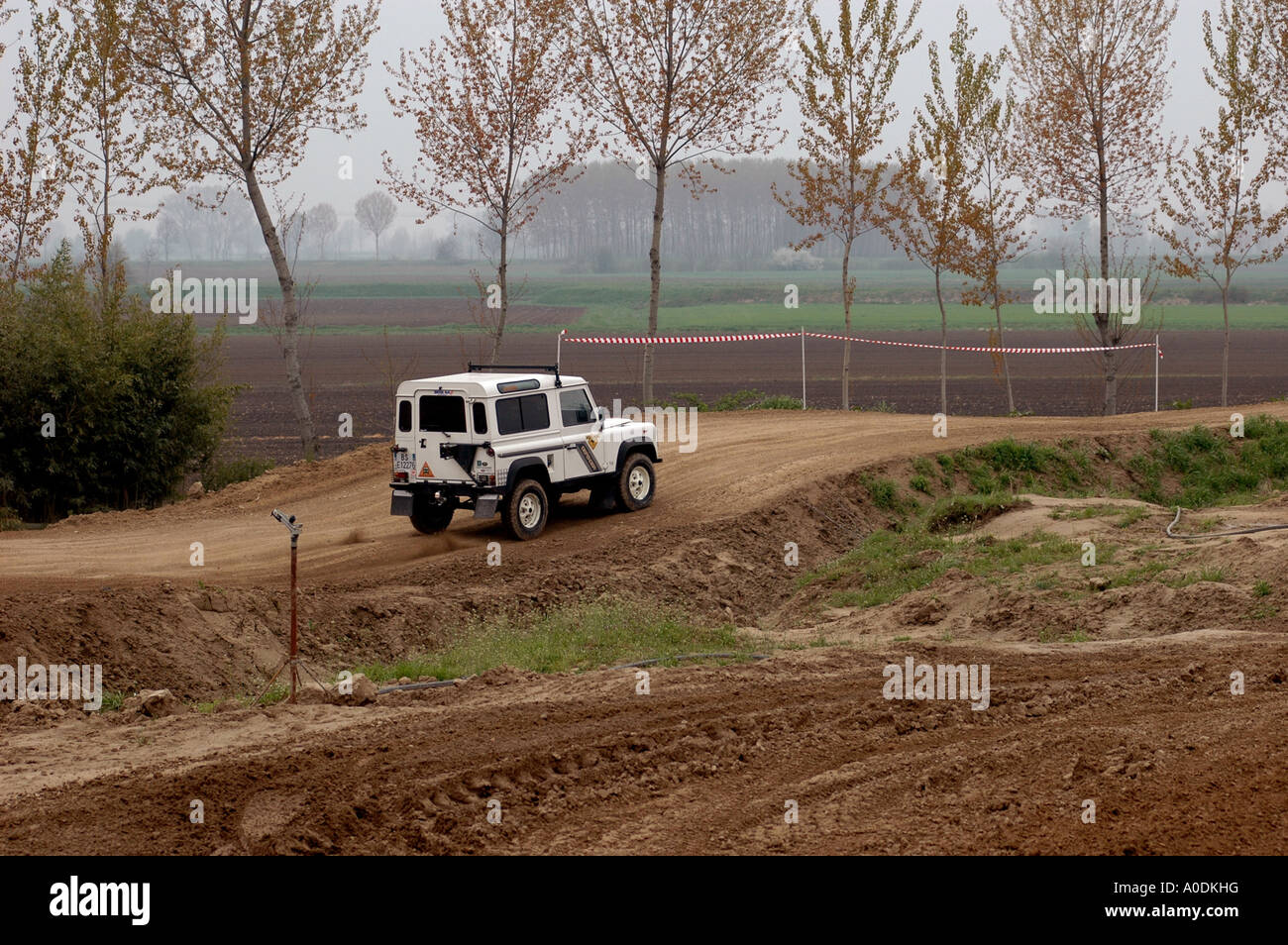 Tele shot of white short chassis Land Rover Defender 90 series on a ...