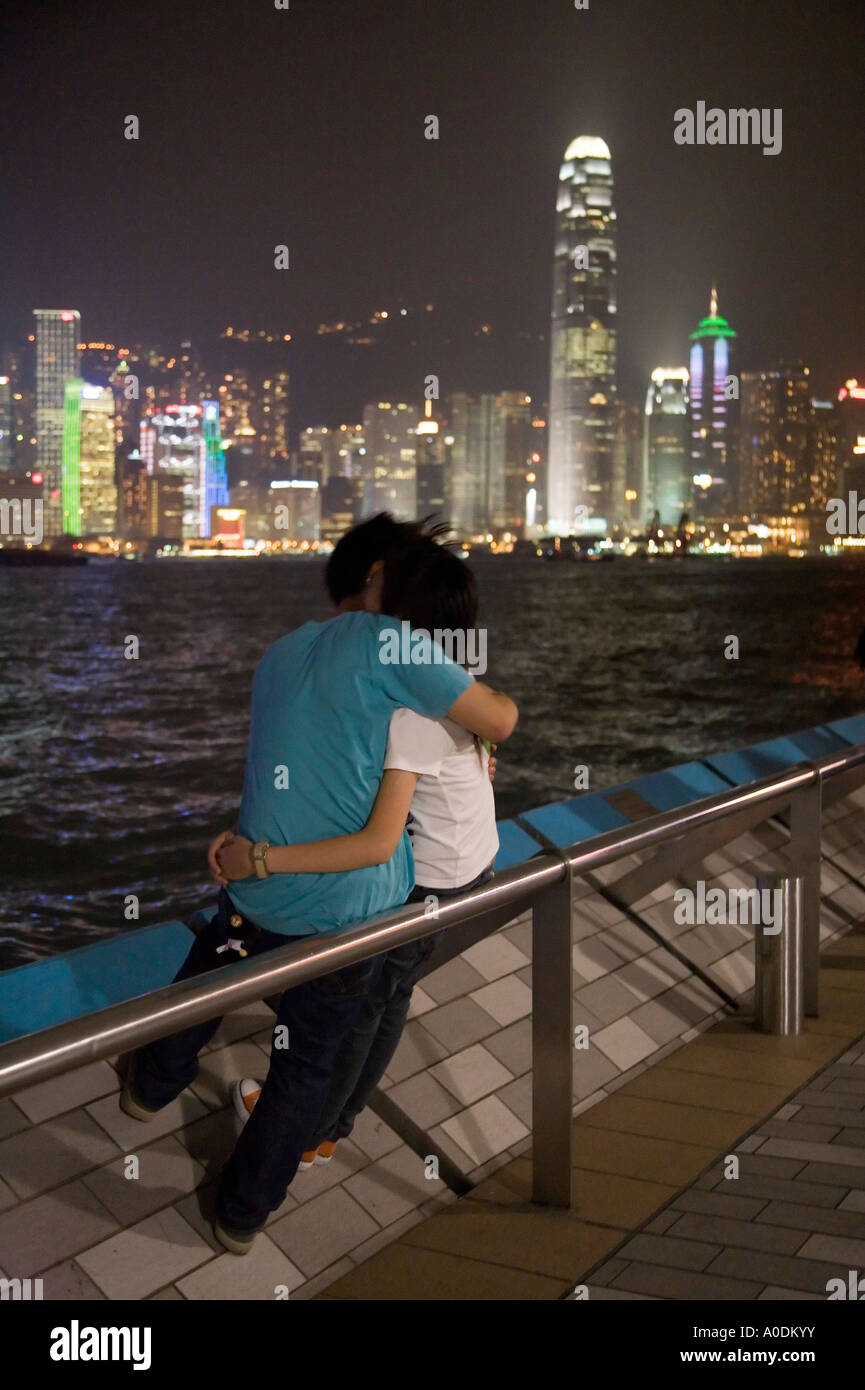 Couple on railings 4- Tsimshatsui Promenade at night, Hong Kong Stock ...