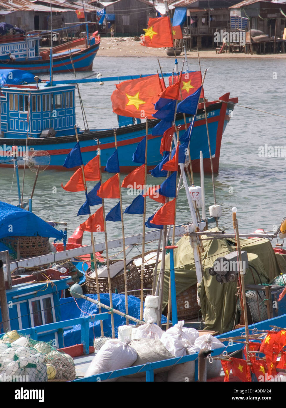 Vietnam Nha Trang city Cai River fishing boats flying national flags ...
