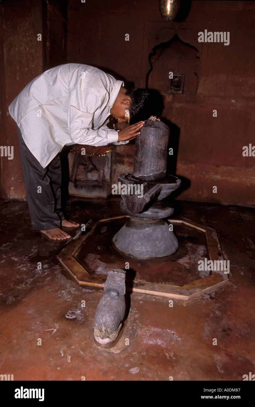Indian boy praying in a small Hindu temple of Varanasi Hinduism Uttar ...