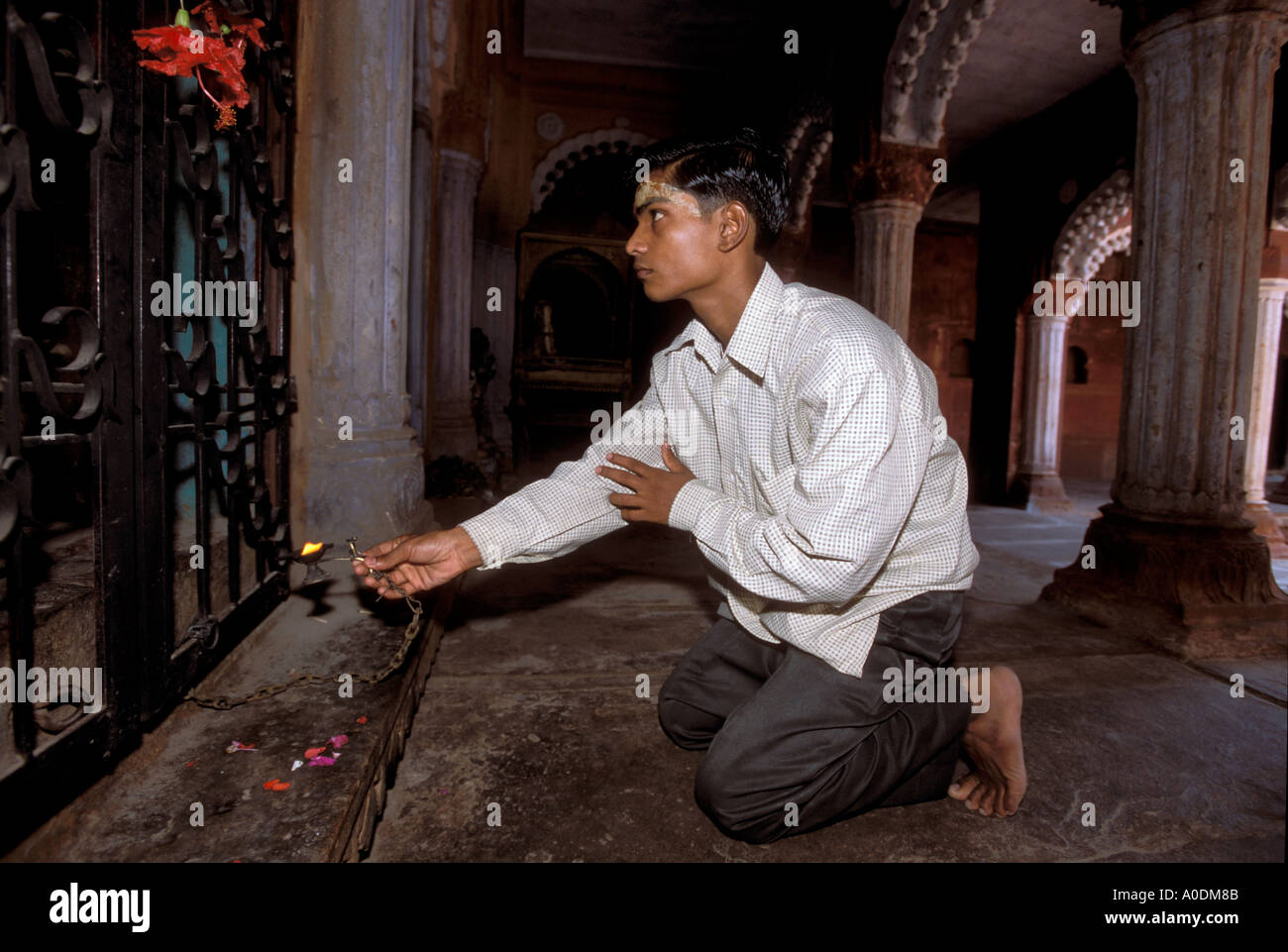 Indian boy praying in a small Hindu temple of Varanasi Hinduism Uttar ...
