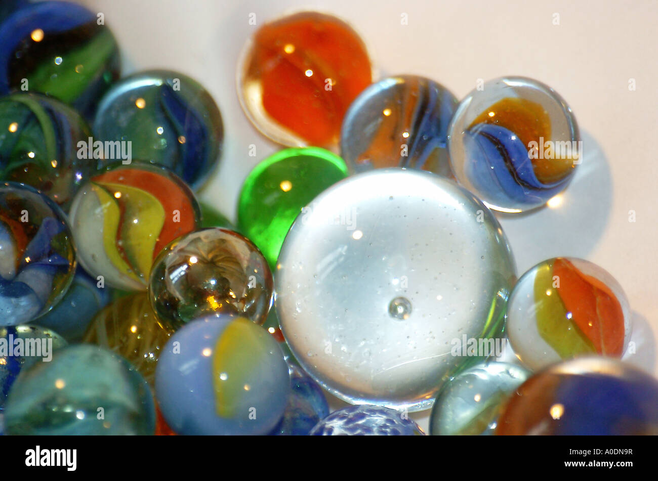 A close up shot reveals the shiny irridescence of individual marbles ...