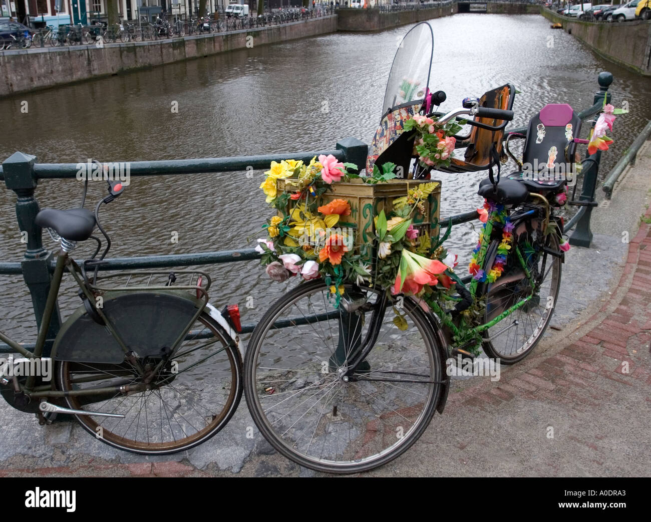 Bicycle decorated with flowers in Amsterdam Stock Photo - Alamy