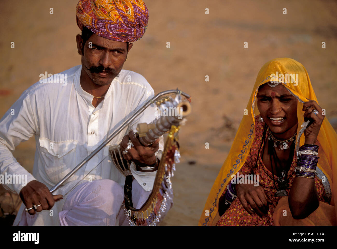 Bopa Gypsy couple performing traditional chants at the Pushkar cultural ...