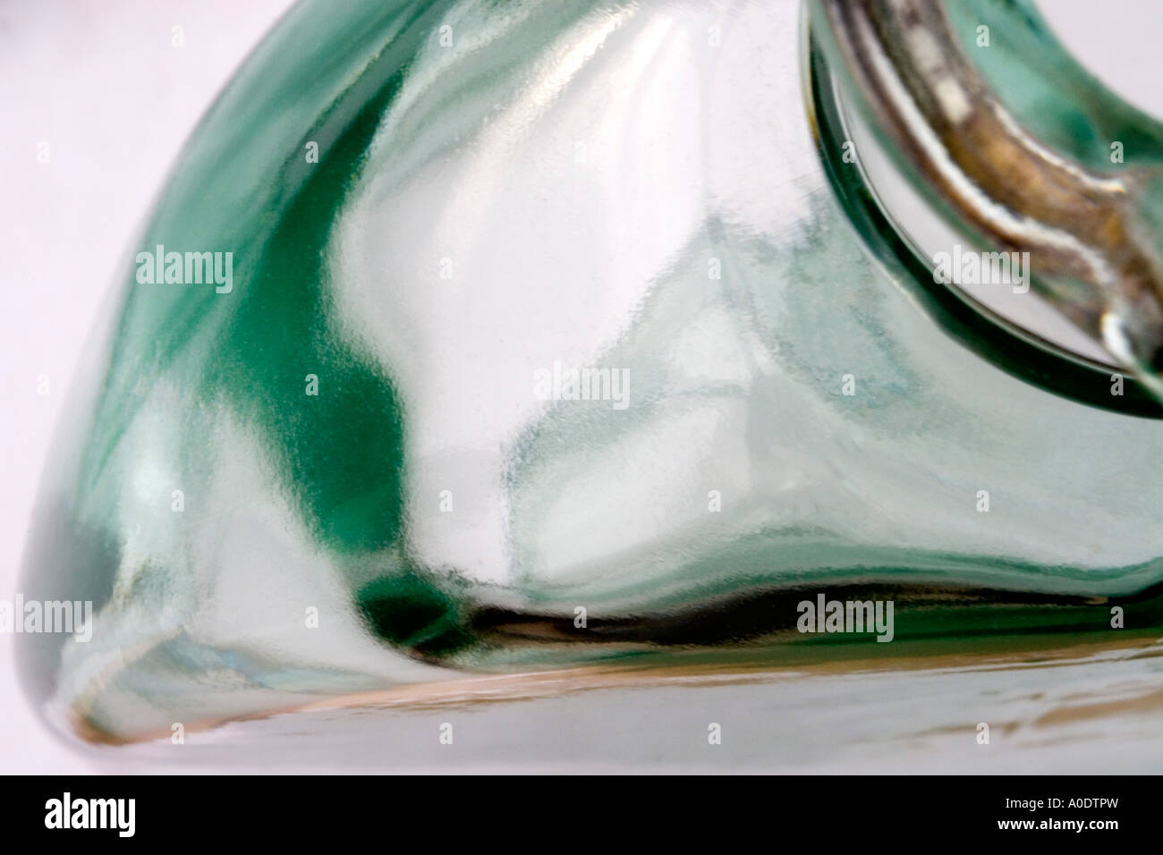 Shoulder of an empty pale green glass olive oil bottle Stock Photo - Alamy