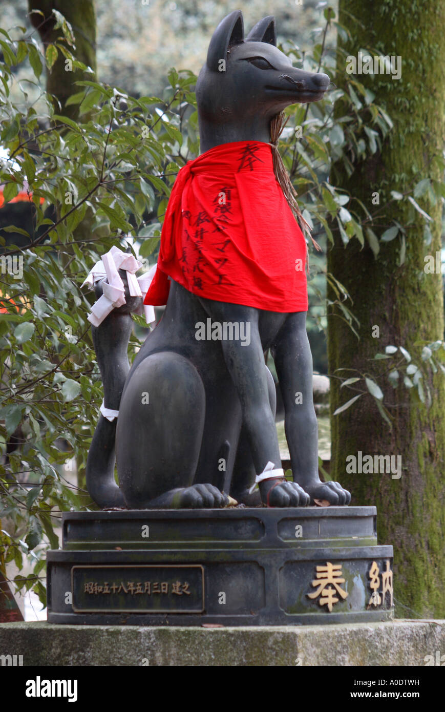 The statue of a fox at Fushimi Inari Taisha shrine near Kyoto city ...