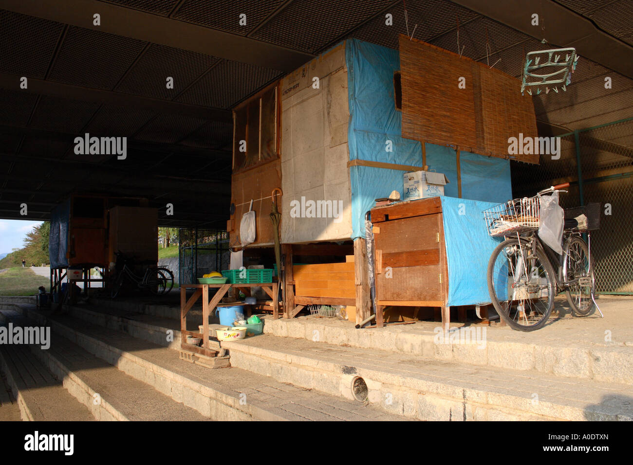 A makeshift shelter built by a homeless man under one of the bridges in ...