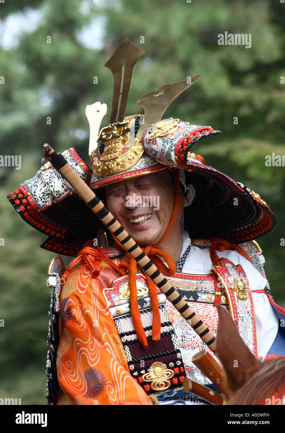 A laughing man on horseback dressed as a Samurai warrior at the Jidai ...