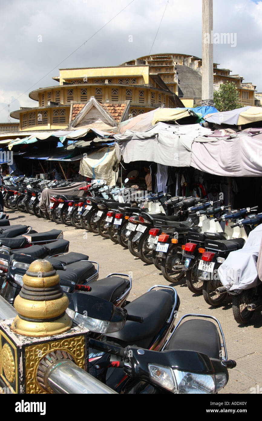 Hundreds of mopeds parked outside the central market in the Cambodian ...