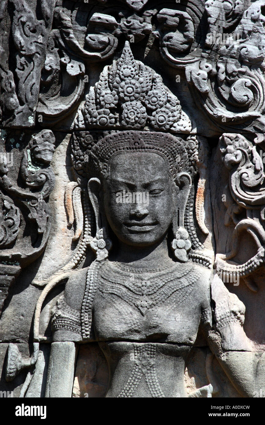 A stone carving of an Apsara dancing girl at Bayon temple in Cambodia ...
