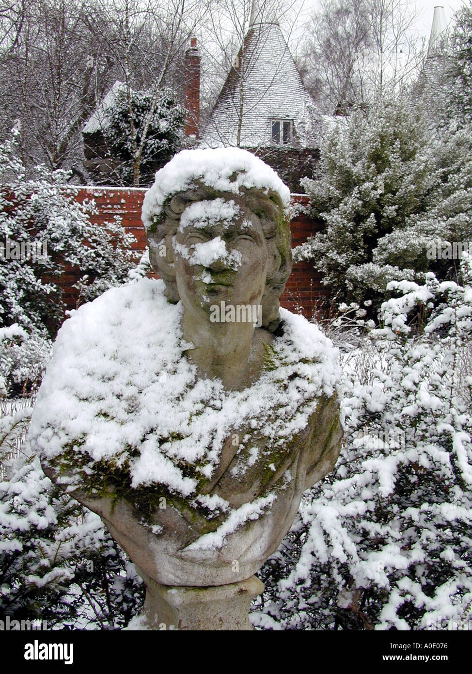 garden statue bust in winter snow Stock Photo - Alamy