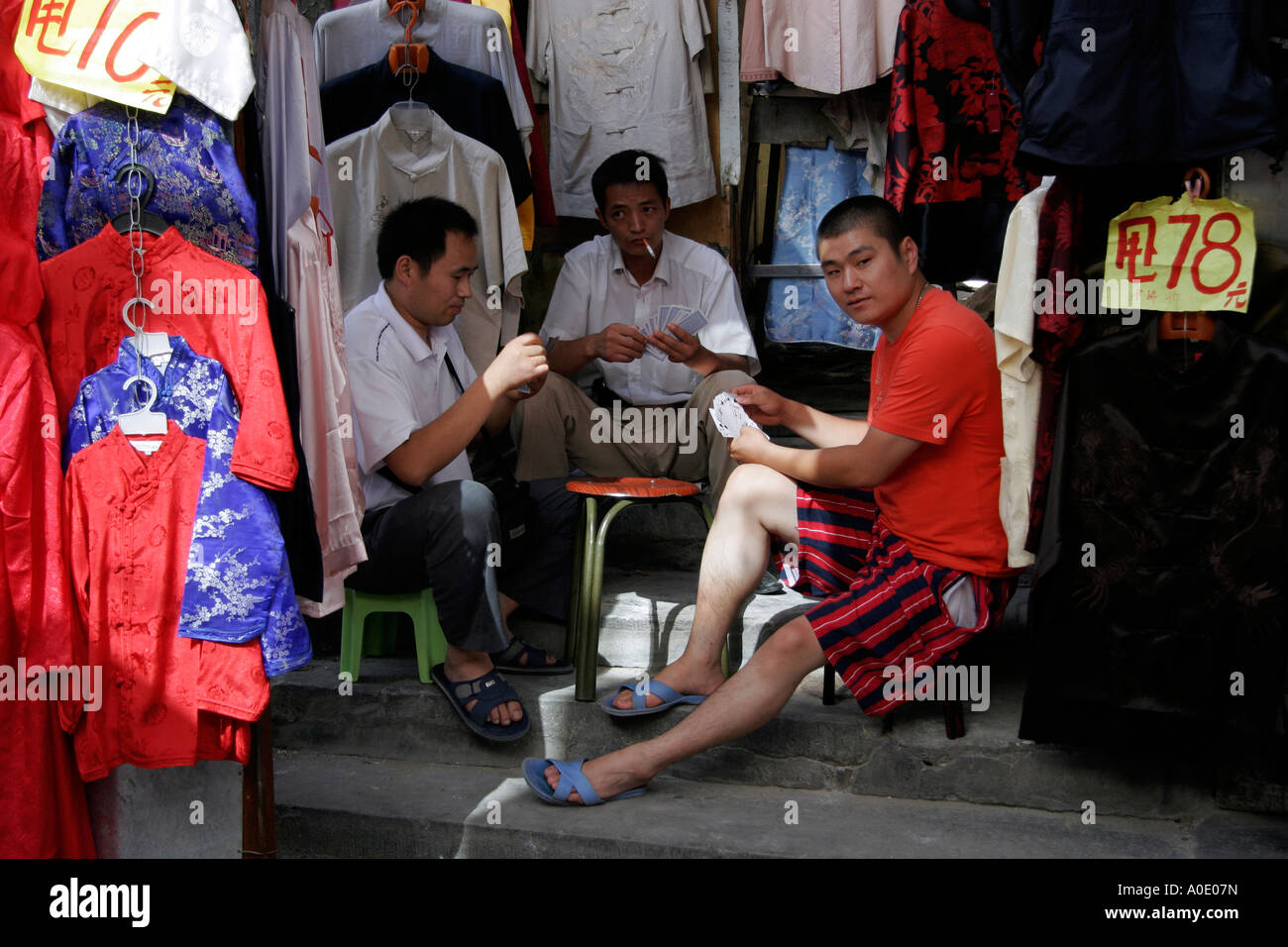 Three men playing cards hi-res stock photography and images - Alamy