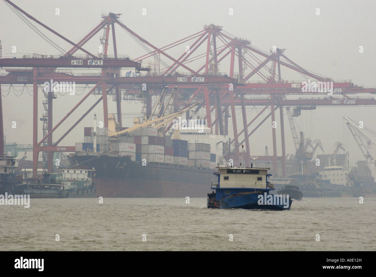 Barge passing docks on the Huangpu river, Shanghai. China Stock Photo ...