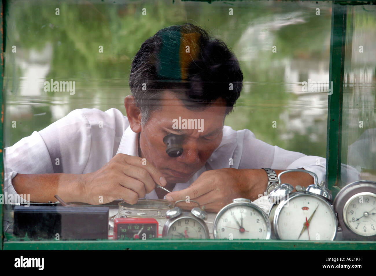 Man repairing clocks hi-res stock photography and images - Alamy