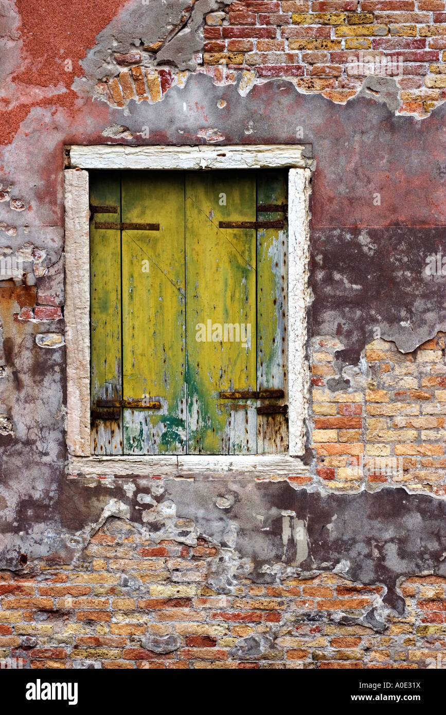Old wooden shuttered window in rendered brickwork Venice Stock Photo ...
