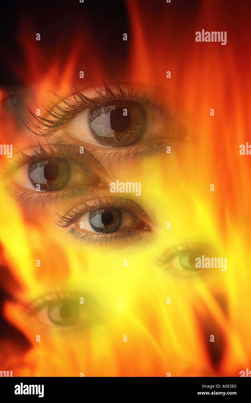Eyes looking through flames Stock Photo - Alamy