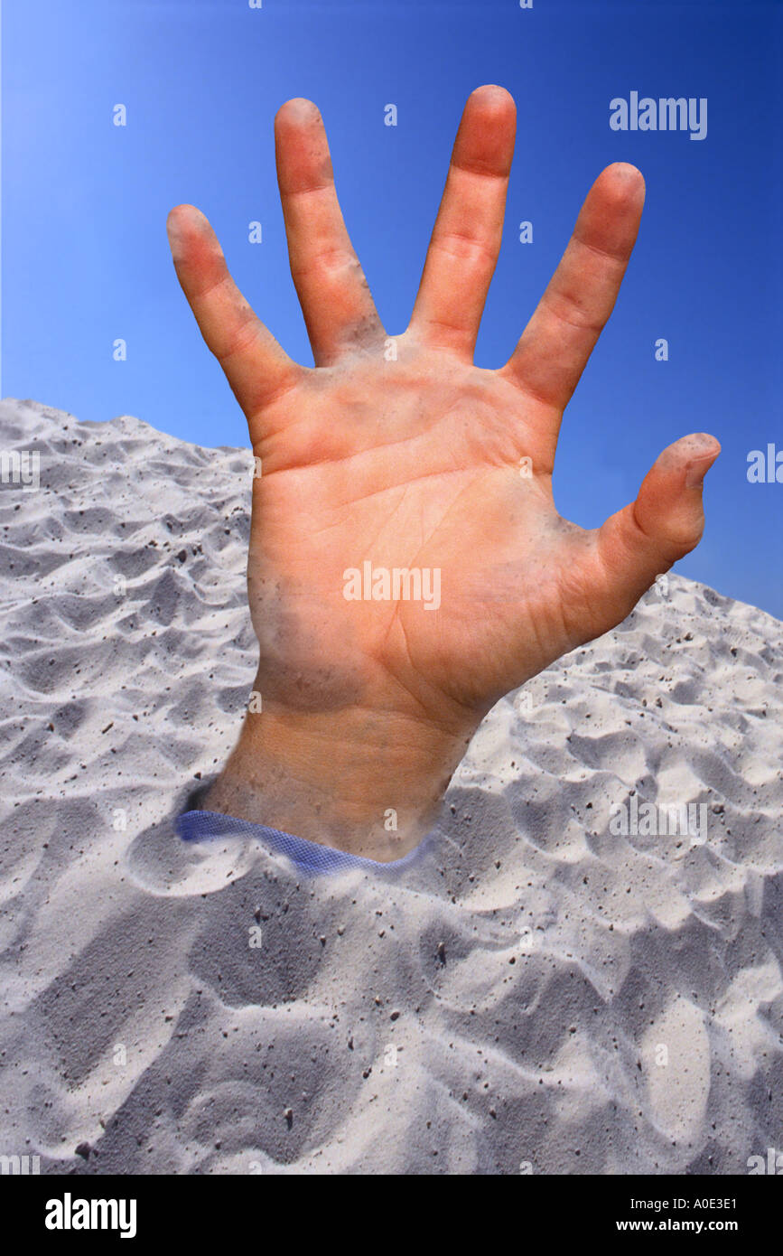 Hand reaching out of sand Stock Photo - Alamy