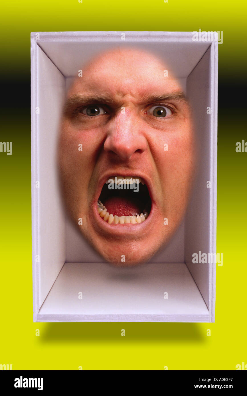 Businessman trapped in box screaming Stock Photo - Alamy