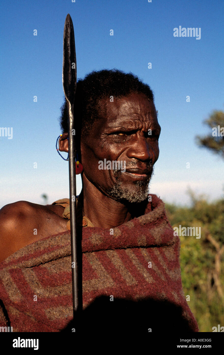 masai warrior standing with spear Stock Photo - Alamy