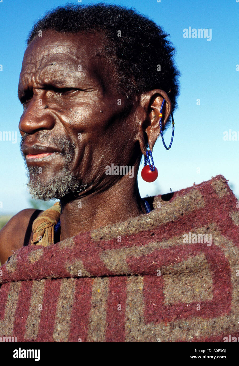 masai tribesman standing erect with a blanket around his body Stock ...