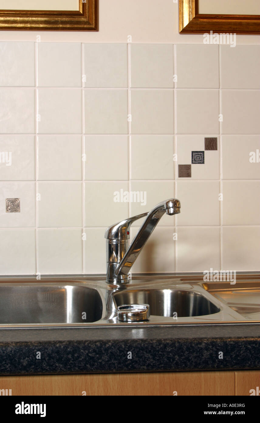 Showhome interior, kitchen sink and taps Stock Photo - Alamy