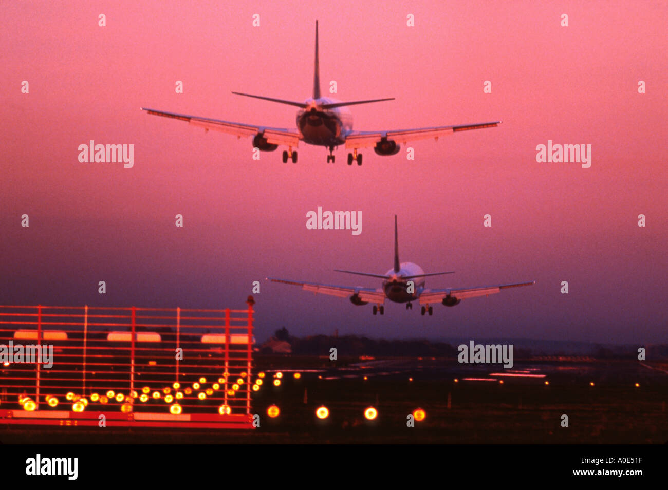 Two jets landing Stock Photo - Alamy