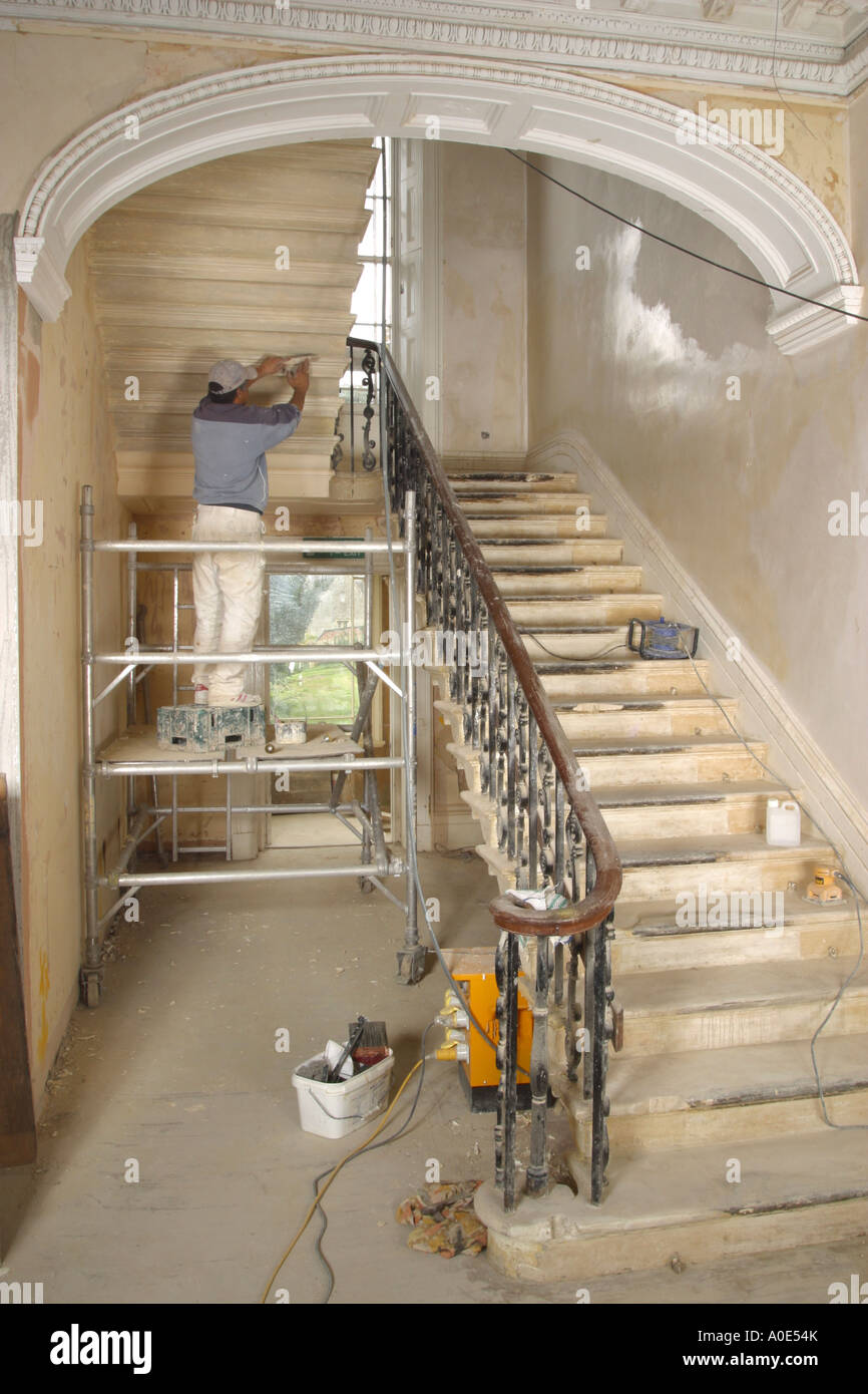 UK property developers workmen working on refurbishment of old house ...