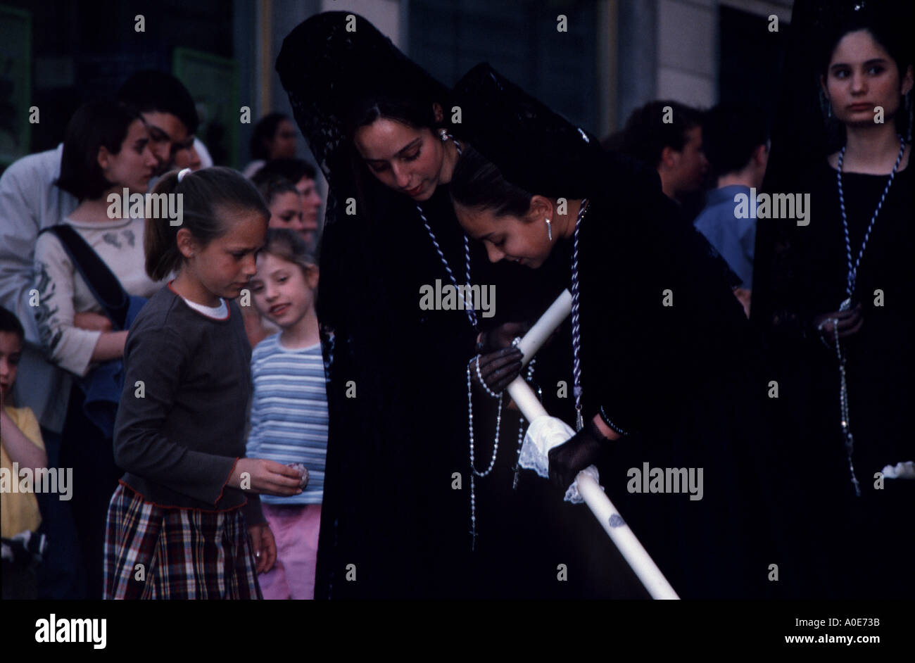 Girls in Traditional Dress lighting Candles in Easter Celebrations in ...