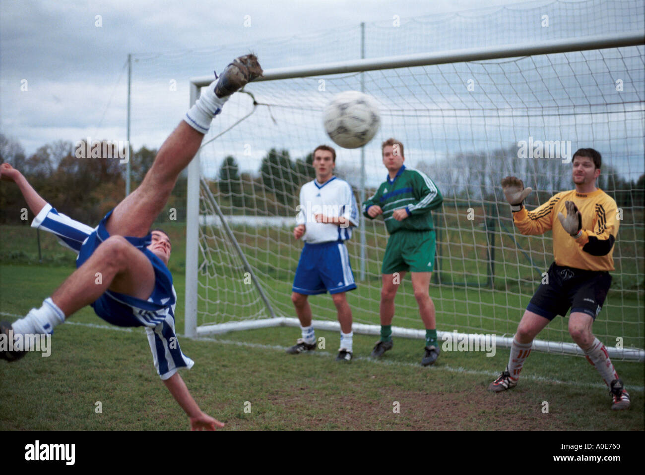 soccer young men playing soccer Stock Photo - Alamy