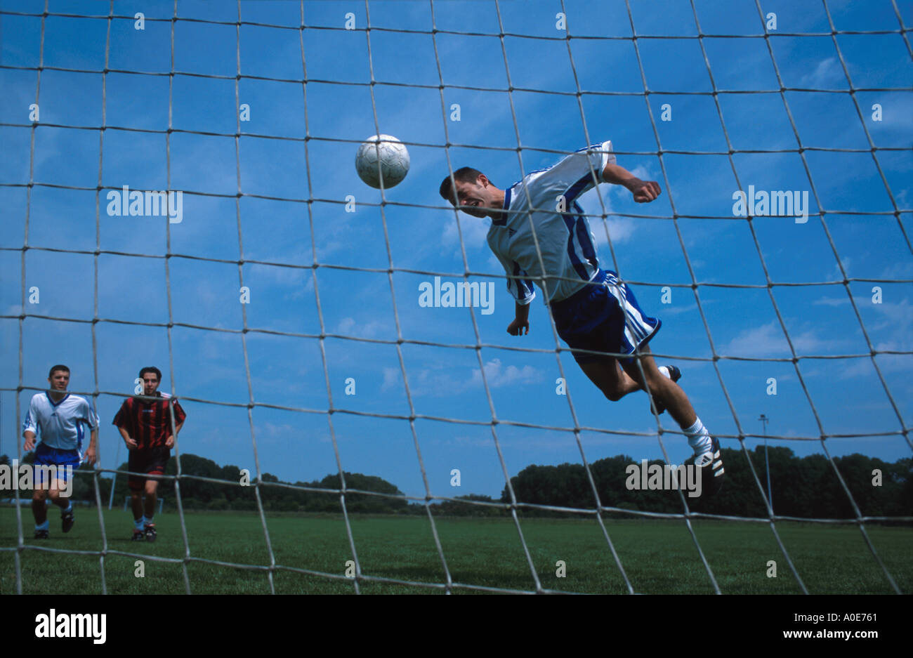 soccer young men playing soccer Stock Photo - Alamy