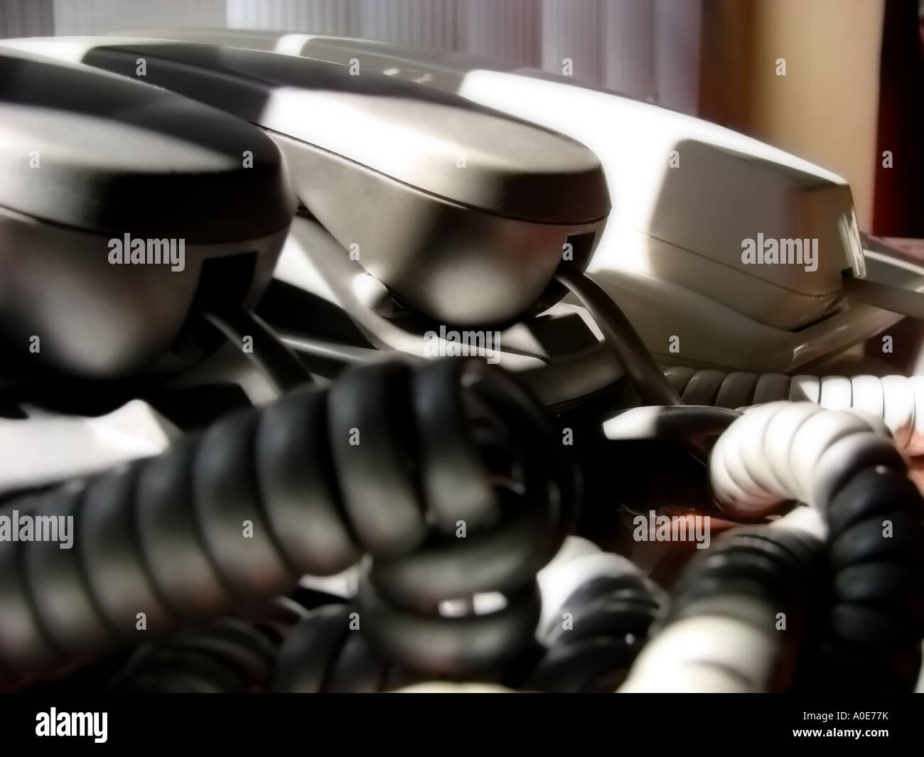 Three desk phones on the desk Stock Photo - Alamy