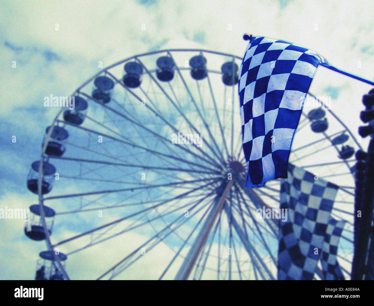 flags with fairground big wheel in background Stock Photo - Alamy