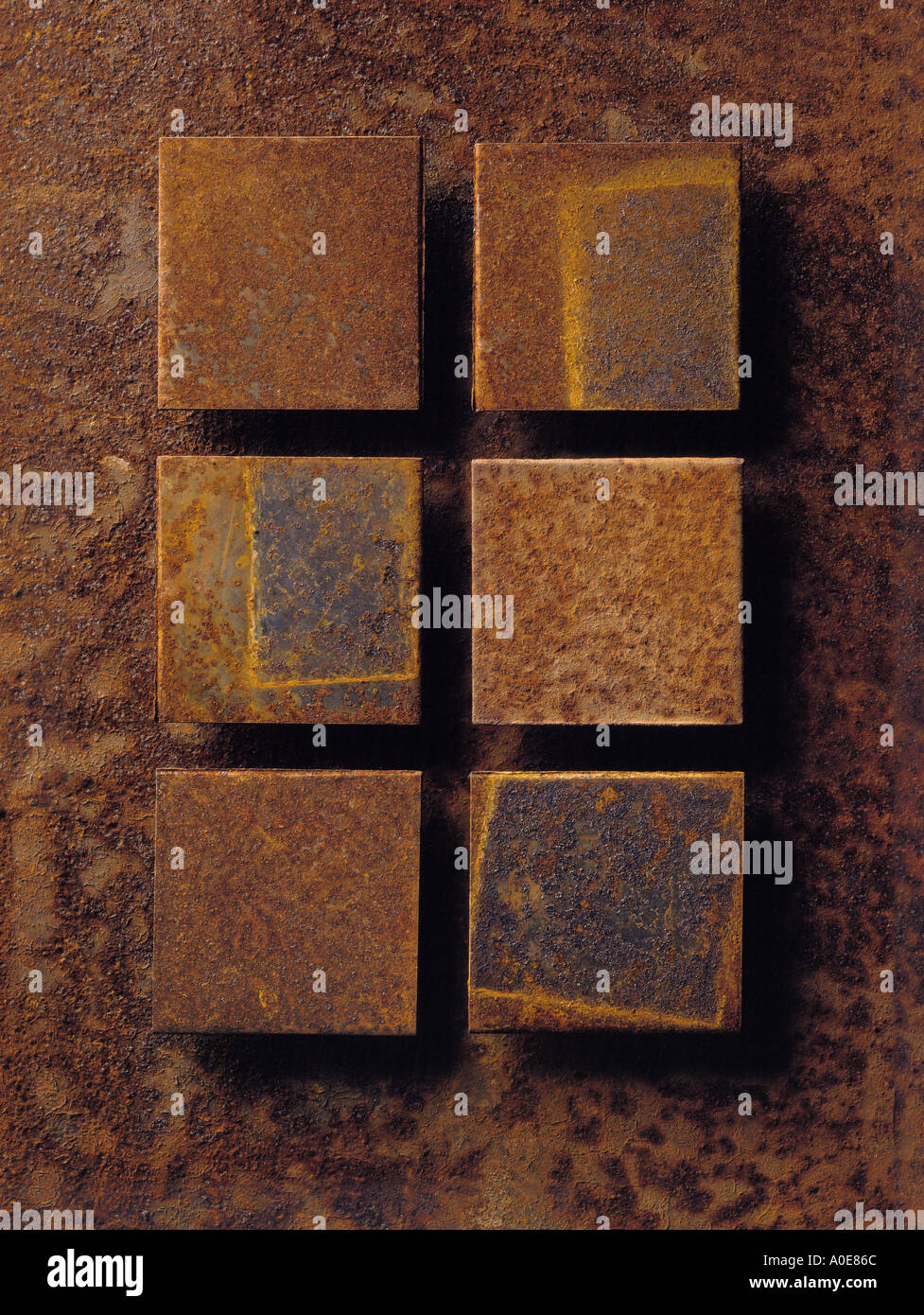 Rusted steel plates arranged on rusted steel background showing ...