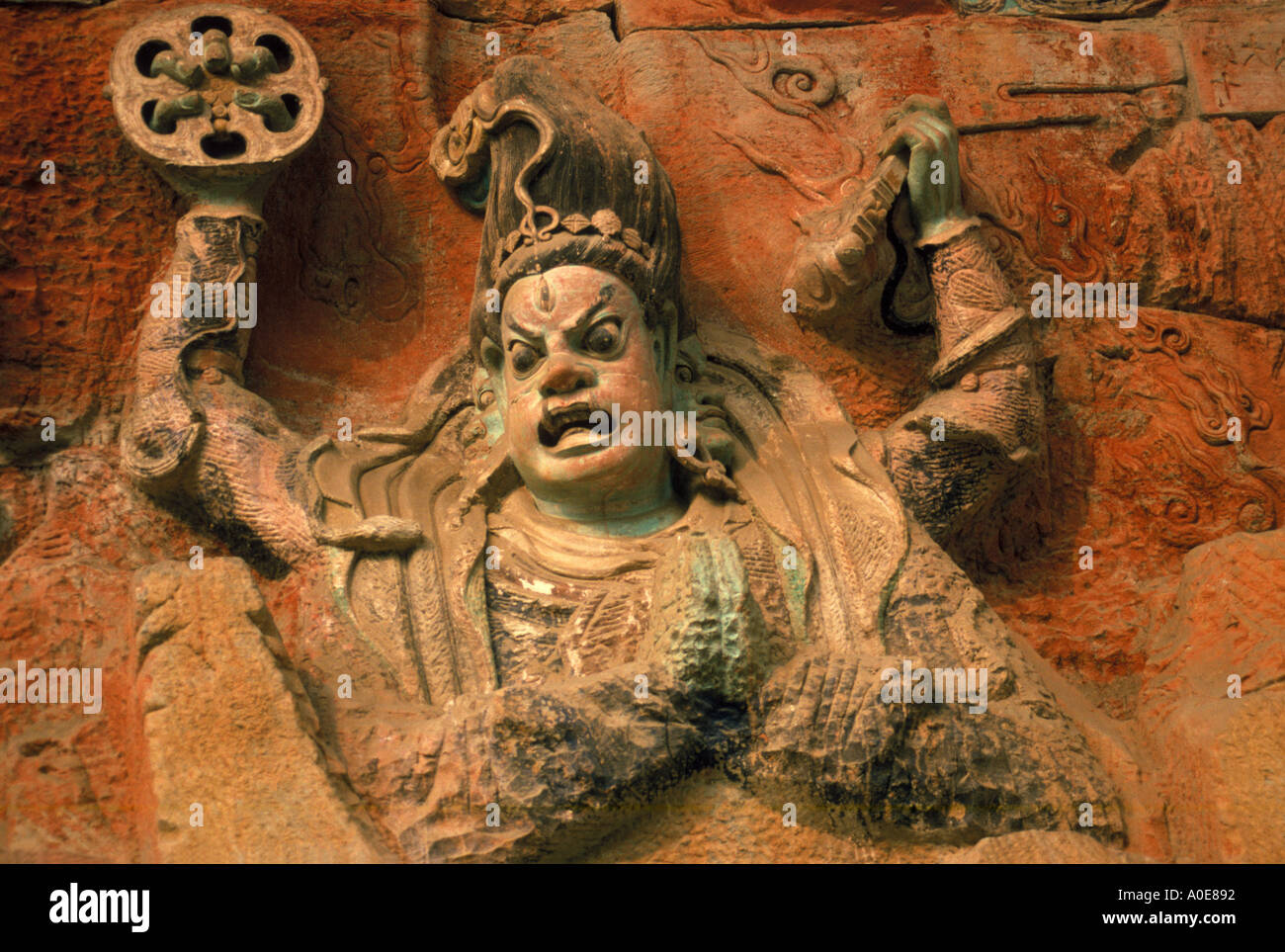 Demon- Buddhist cave carvings at Dazu China Stock Photo - Alamy