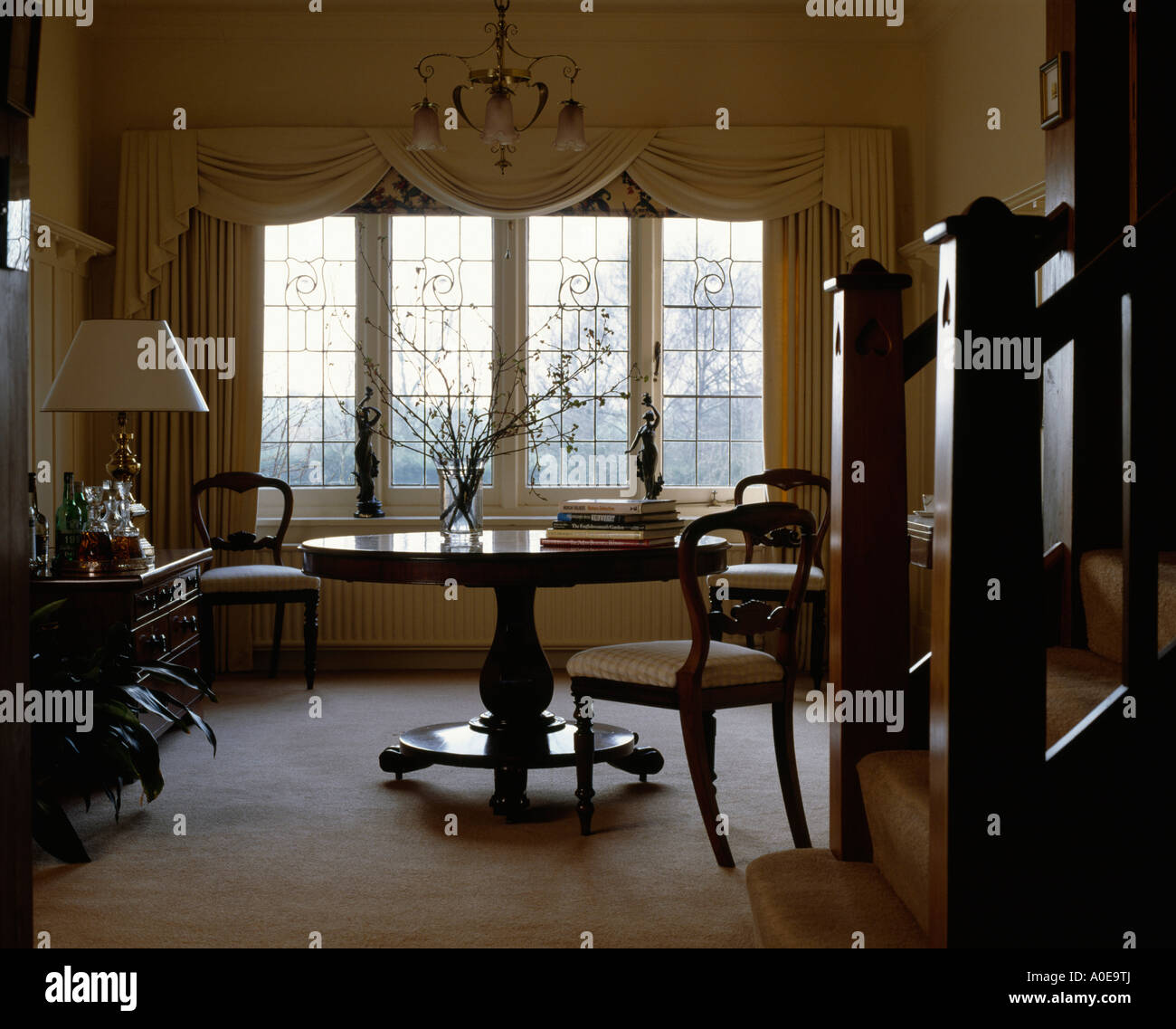 Circular diningtable in country house with view through window Stock ...