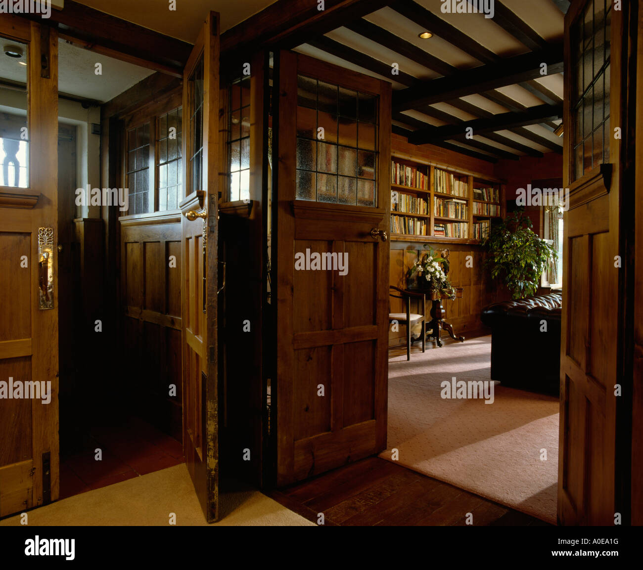 Doors open into hall and livingroom Stock Photo - Alamy