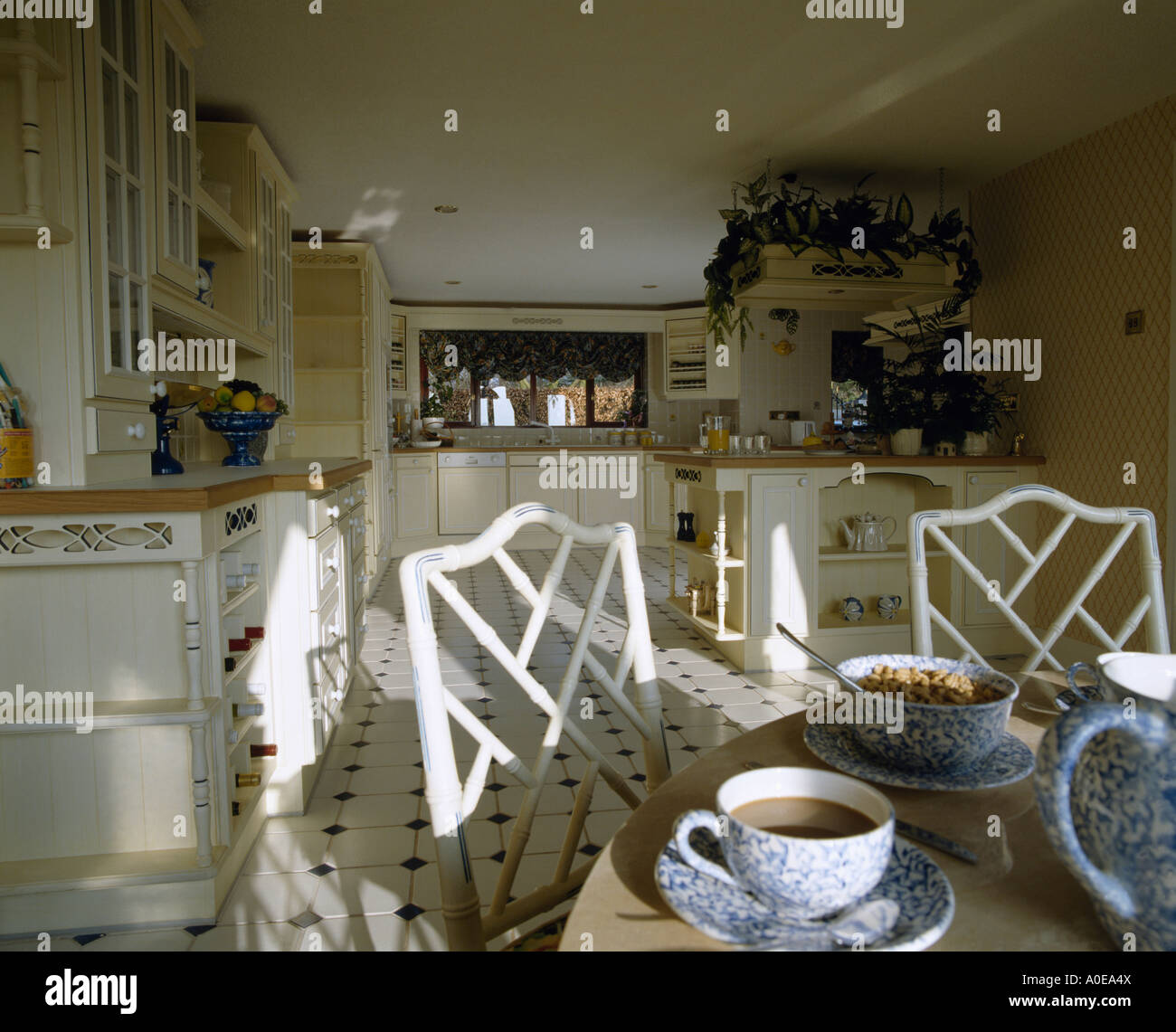 Cup and saucer on table in traditional kitchen Stock Photo - Alamy