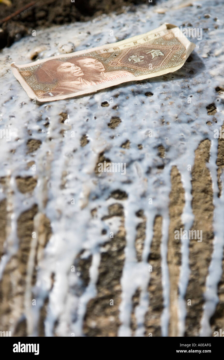 Money offering left on melted wax candles- Drepung Monastery, Lhasa ...